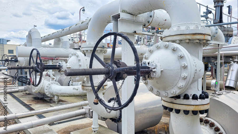 Valves on the petrochemical tank farm with pipelines Stock Photo ...