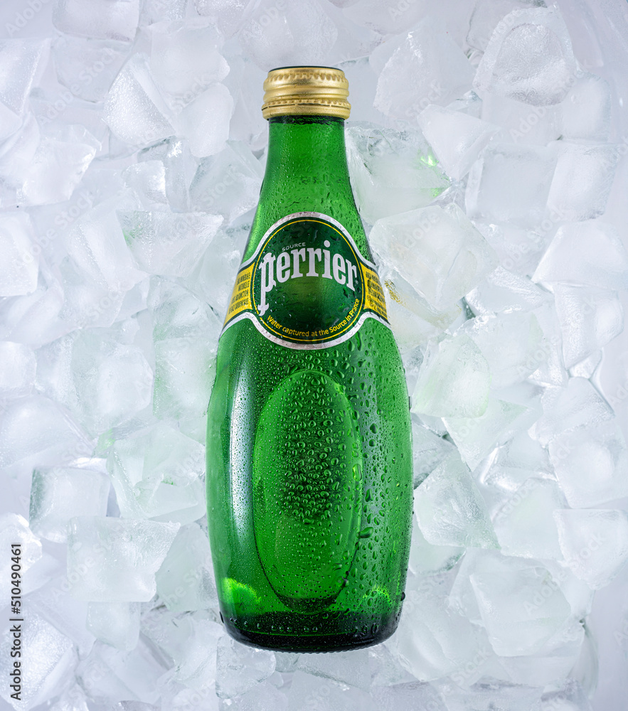 bottle of Perrier, a French brand of natural bottled mineral water in ...