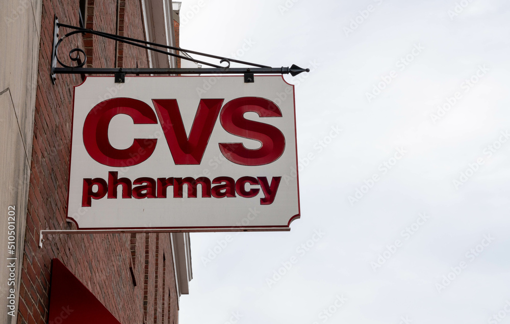 Salem, MA USA - June 12, 2022 - A carved wooden CVS Pharmacy sign hangs ...