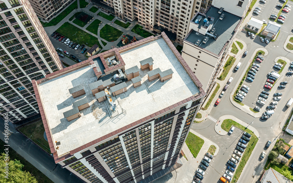 roof of high-rise residential building with ventilation systems and ...