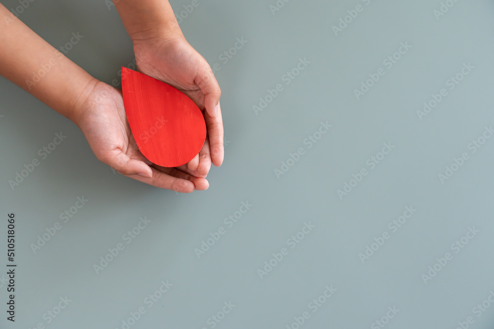 Blood donation or medical surgery concept. Human holding small piece of ...