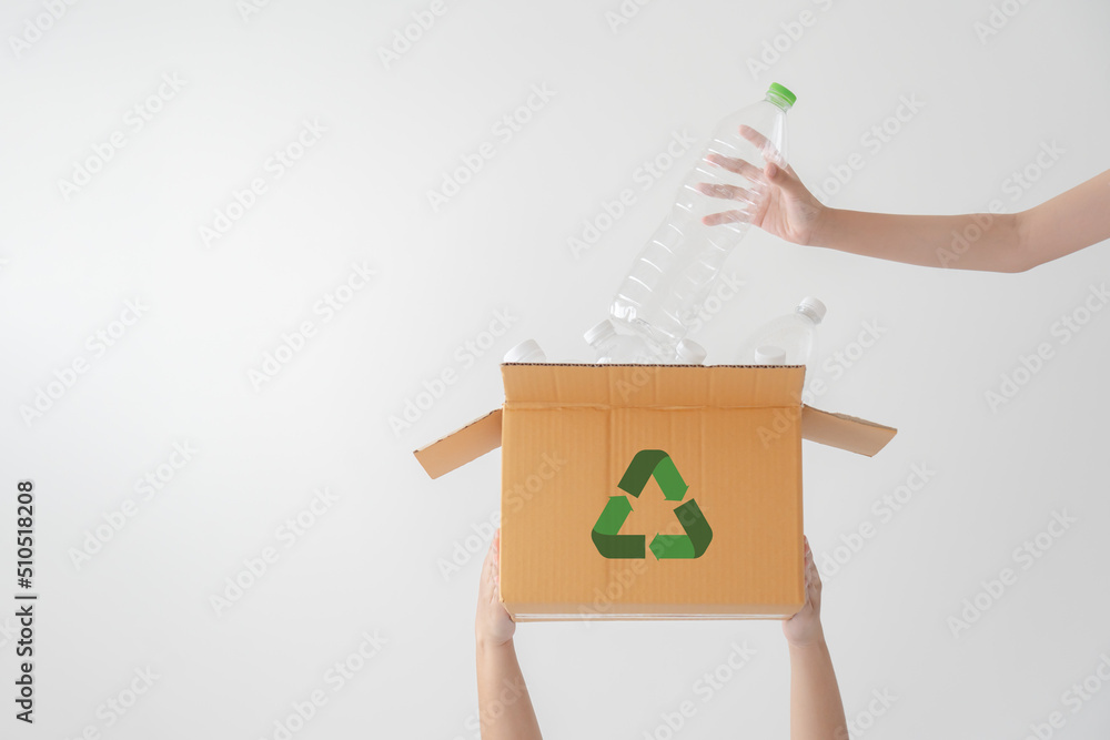 People launch a campaign to recycle used empty plastic bottles. Hands ...
