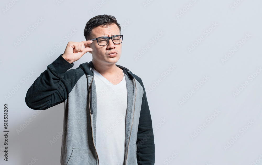 People gesturing with his hand showing something small size with his ...