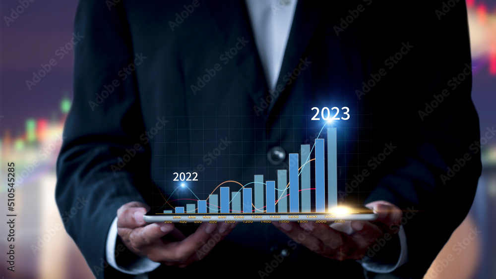 Businessman show stock market bar chart grow up to target. Business ...