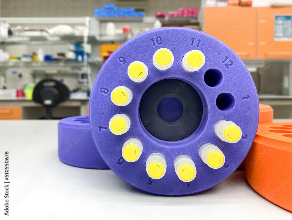 Set of cryovials in purple container for cryopreservation of biological ...