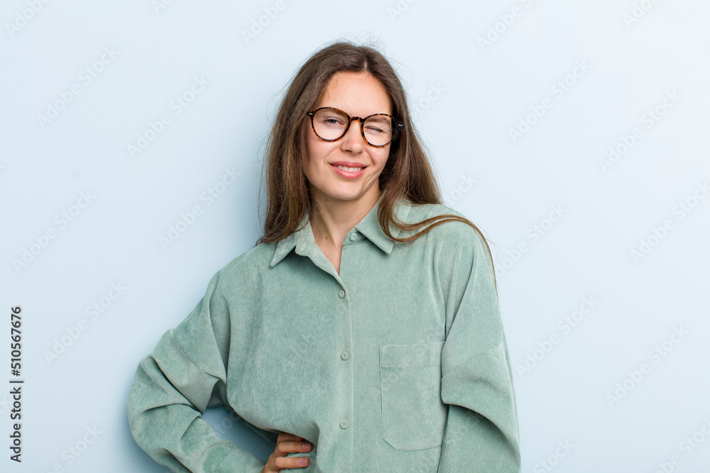 young adult pretty woman looking happy and friendly, smiling and ...