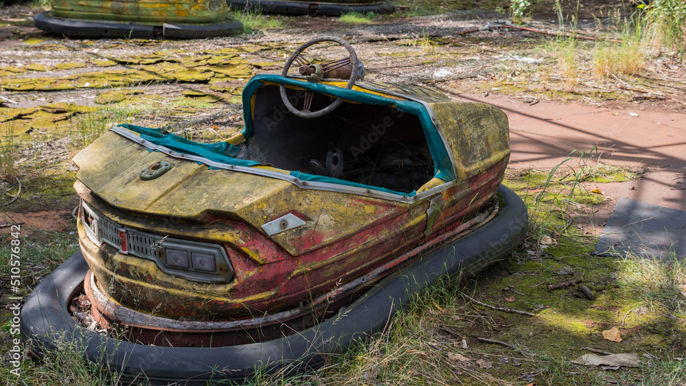 Close up rusty radioactive children electric car after explosion fourth ...