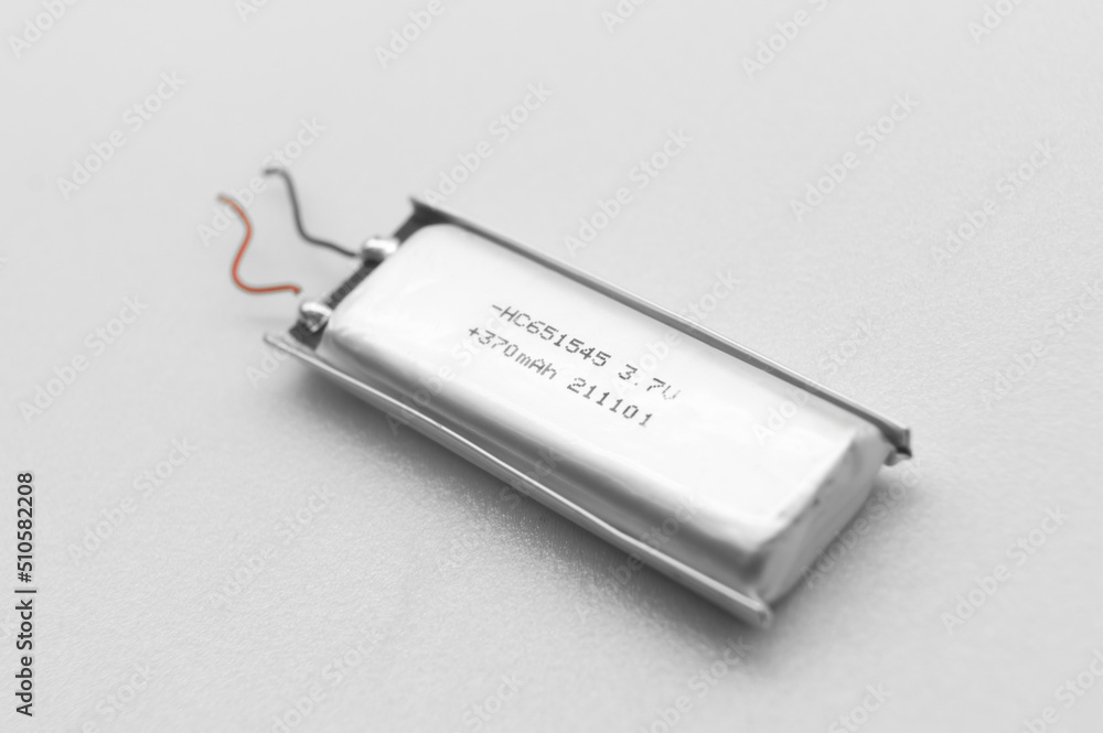 Lithium polymer battery on a white background. Compact small lithium ...