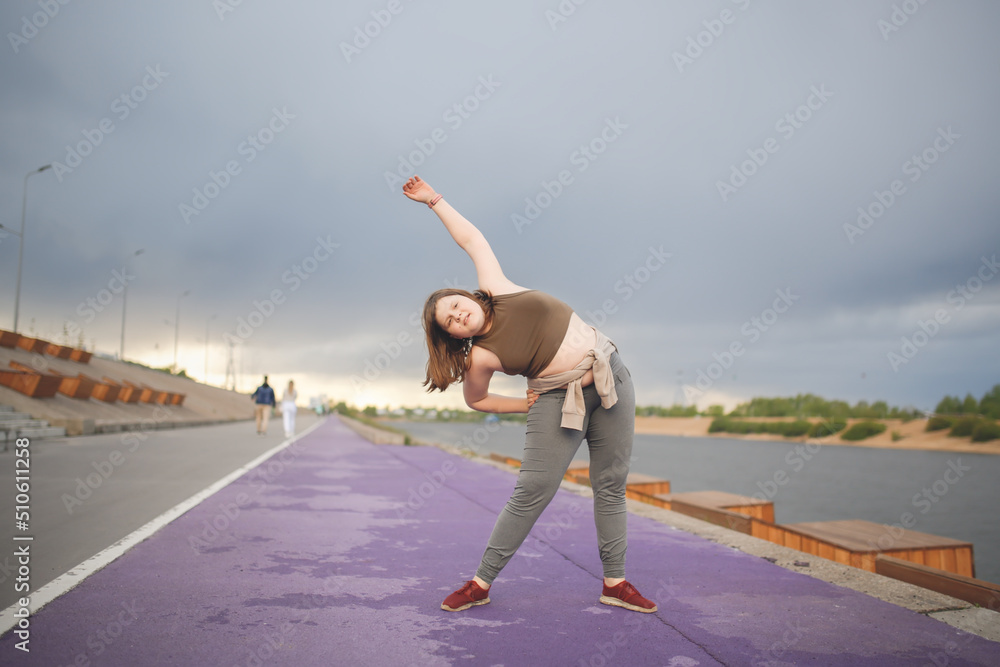 Obese fat kid girl training and exercise at park town on morning ...