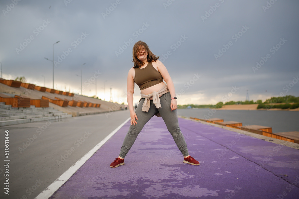 Obese fat kid girl training and exercise at park town on morning ...