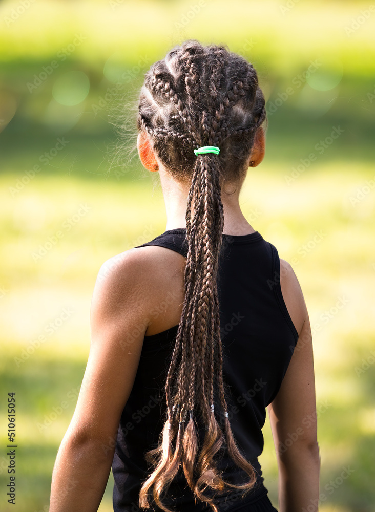 Back view of girl trainee gymnast on training of rhythmic gymnastics in ...