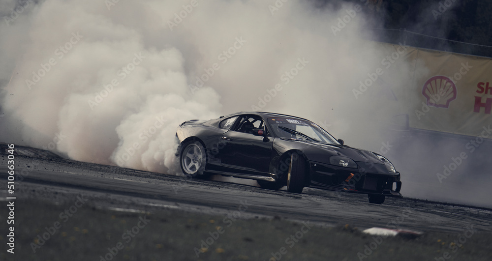 11-05-2022 Riga, Latvia car drifting on asphalt racing track with lot ...
