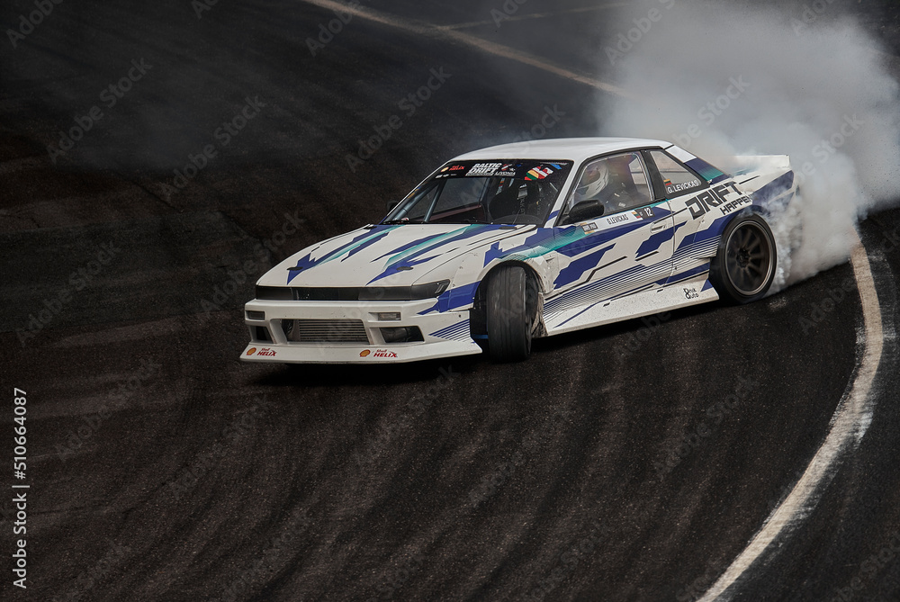 11-05-2022 Riga, Latvia car drifting on asphalt racing track with lot ...