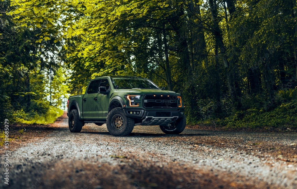 Seattle, WA, USA March 1, 2022 Green Ford Raptor with a vinyl wrap ...