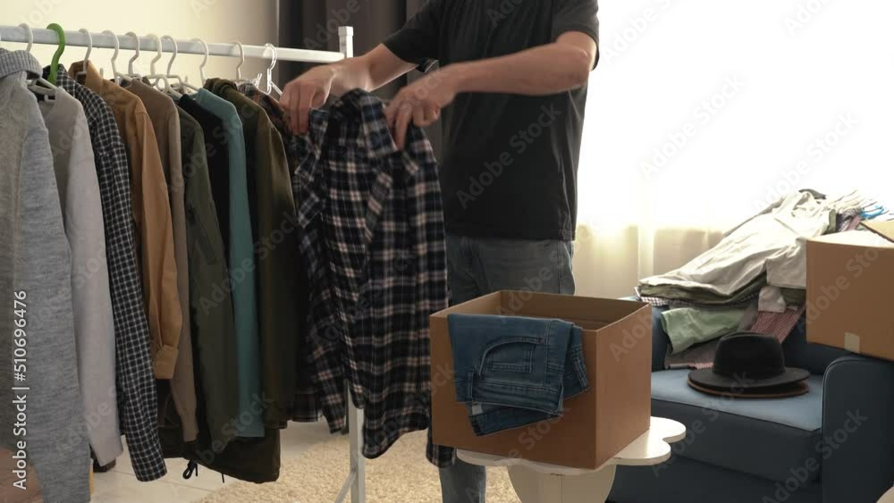 Vidéo Stock No face. Wardrobe ore closet for man sorting clothes for ...