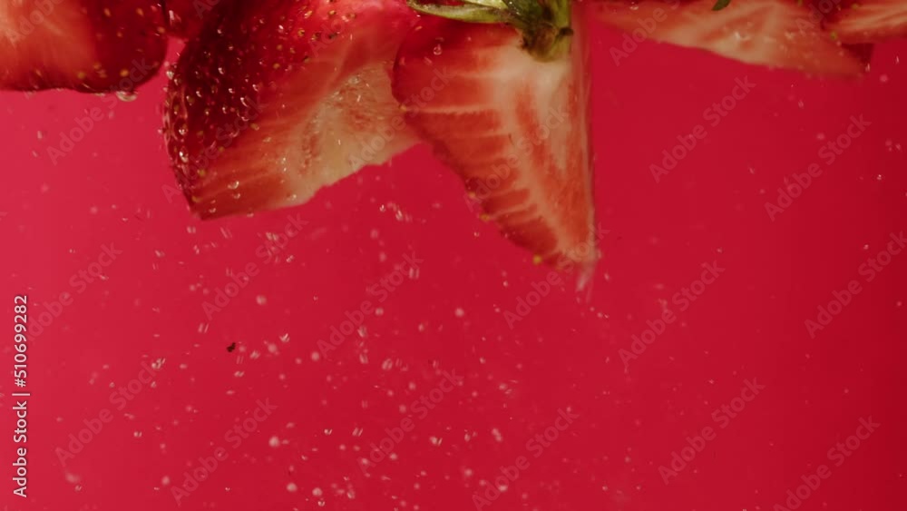 Cooking strawberry sweet cocktail, cold lemonade with red berries, carbonated water with ...