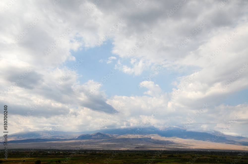 The panoramic view of mount Ararat hidden by clouds which rises above ...