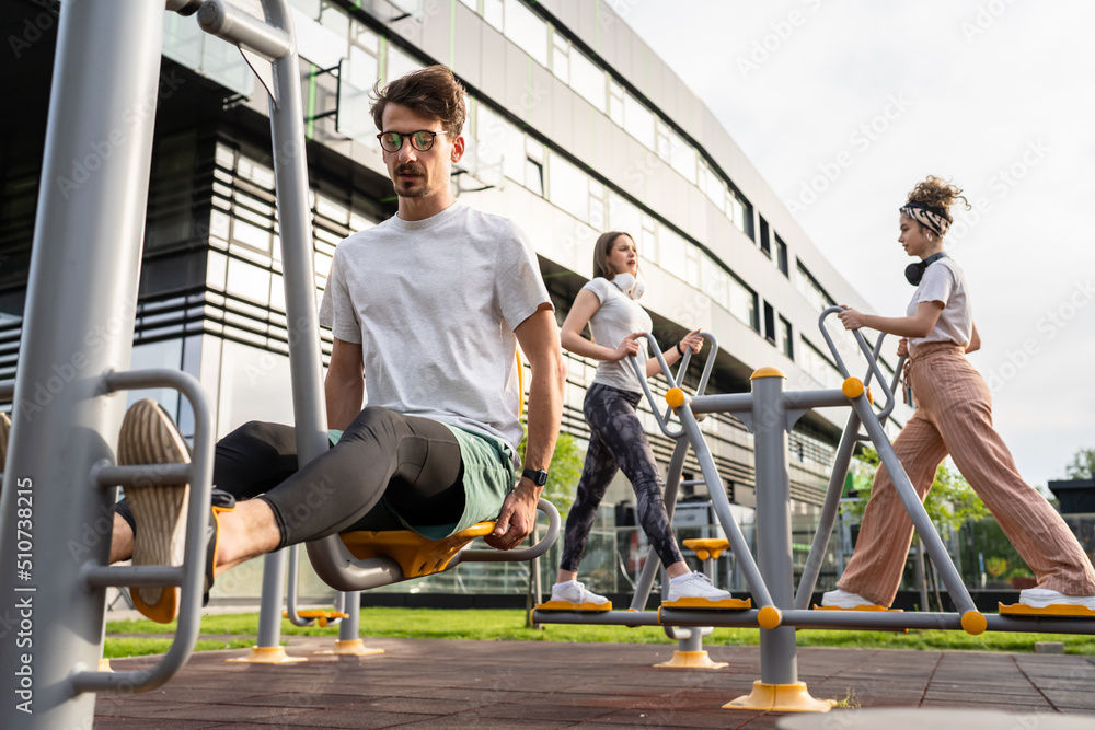 Group of friends man and women male and young adult people training at ...