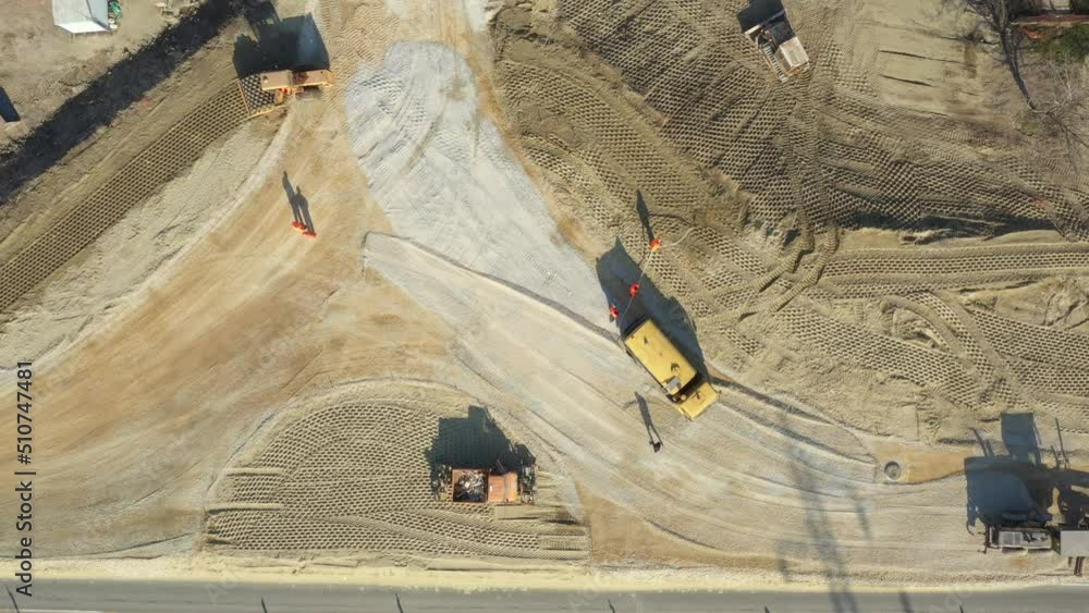 Above top view, dolly move overhead on workers as watering construction ... Above top view, dolly move overhead on workers as watering construction ...