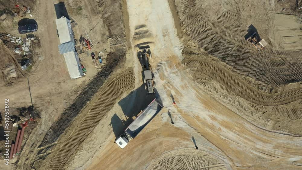 Above top view, overhead on tipper truck as lifting his trailer to ...