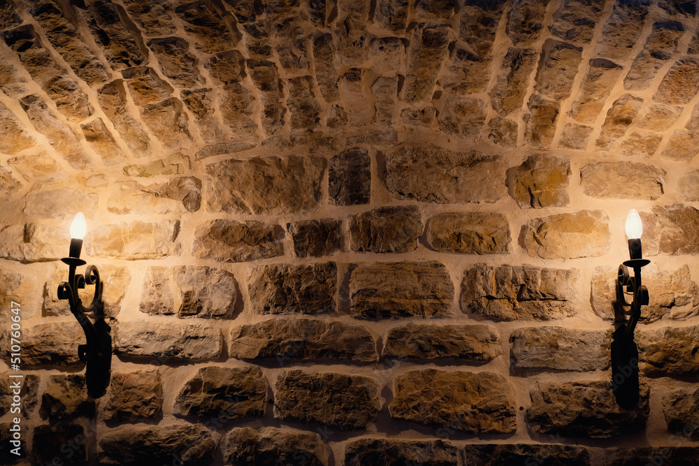 ancient stone wall with candles architecture background, religion ...