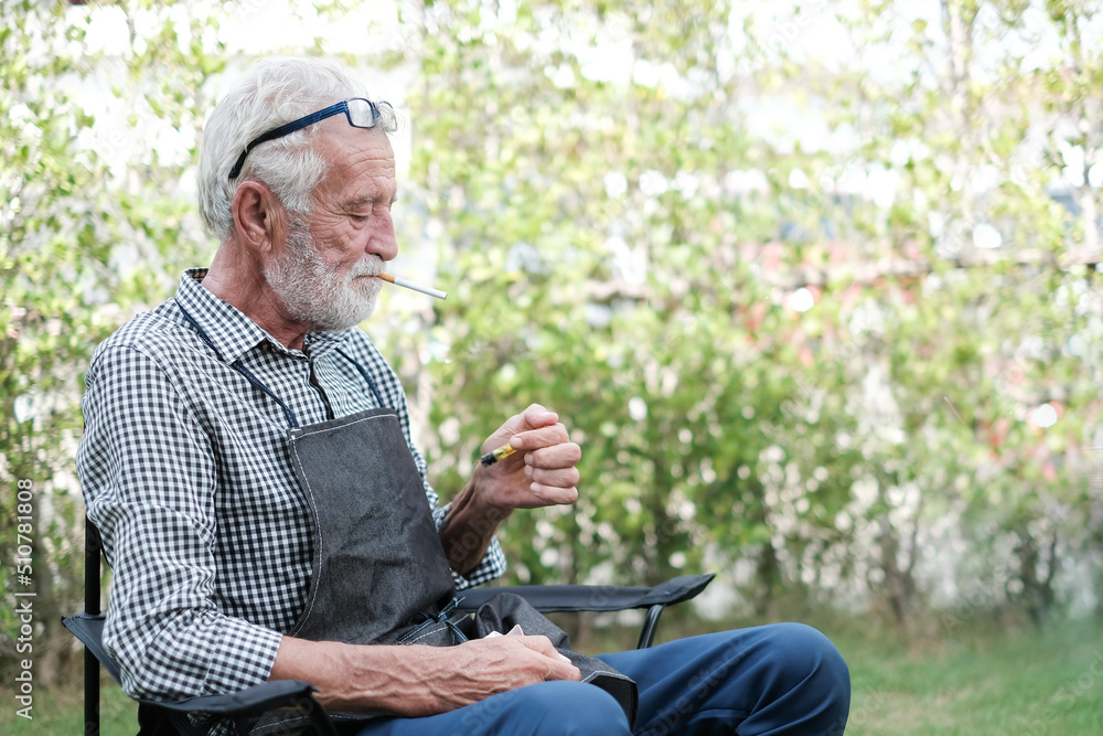 Elderly man smoking cigarette. Senior man or Old man smoking a cigar ...