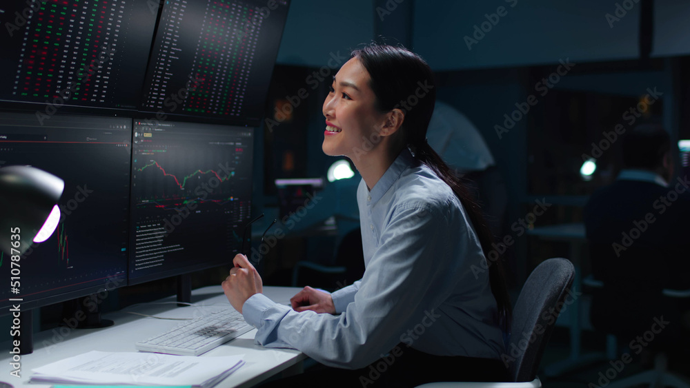 Happy financial analytics looking at screen with chart and smile Stock ...