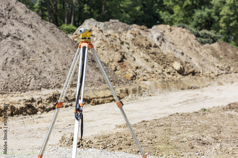 Foto de Level surveying on construction site. Survey measuring level ...