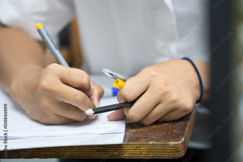 high school,university student study.hands holding pencil writing paper ...