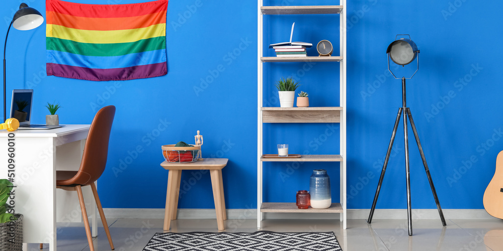 Interior of modern room with rack, workplace and LGBT flag Stock Photo ...