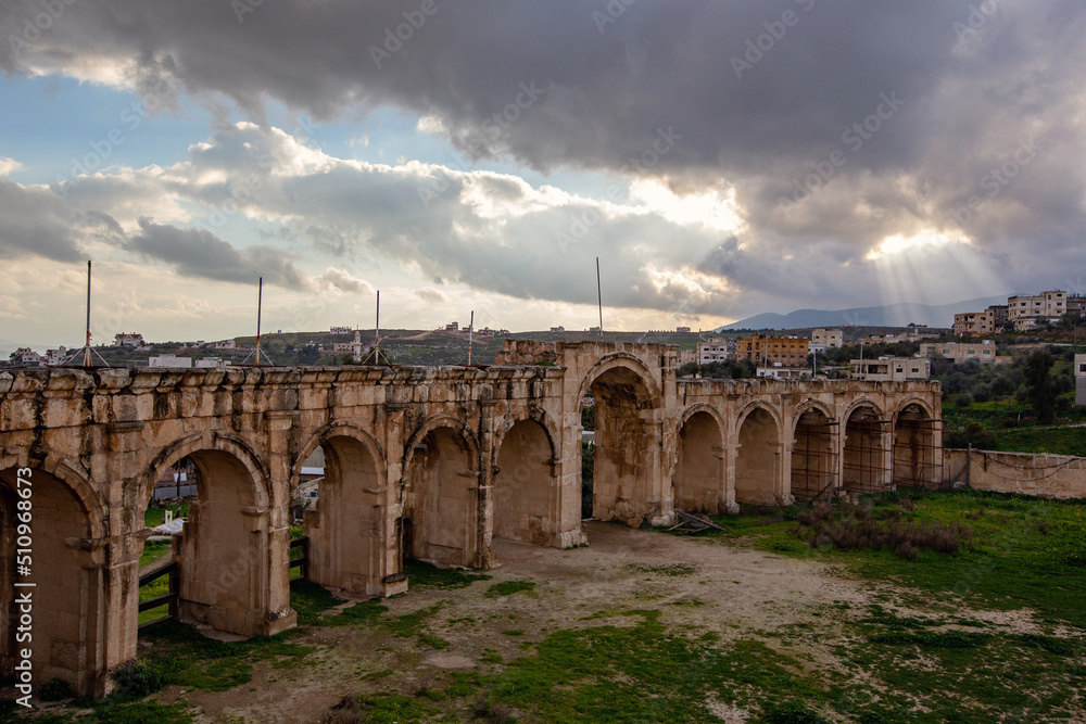 Roman ruins in Jerash town in Jordan. Ancient Roman arch at Jerash town ...