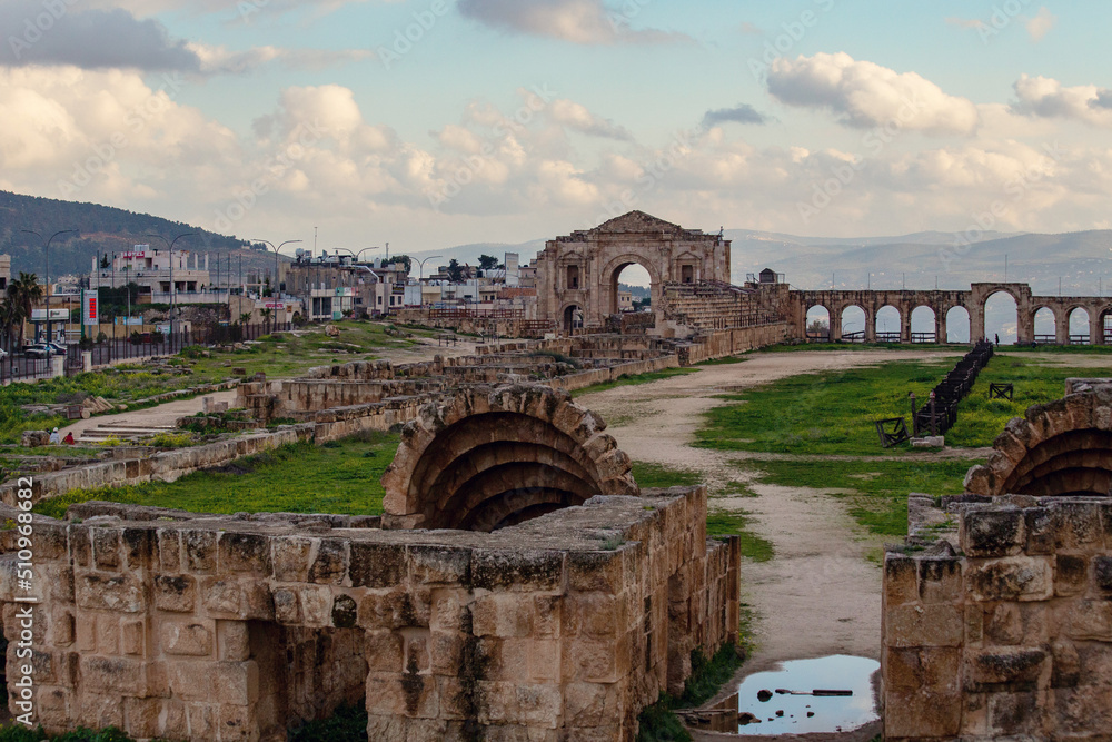 Roman ruins in Jerash town in Jordan. Ancient Roman arch at Jerash town ...