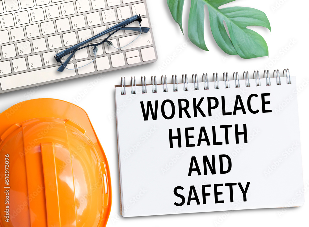 Orange safety helmet with words workplace health and safety write in ...