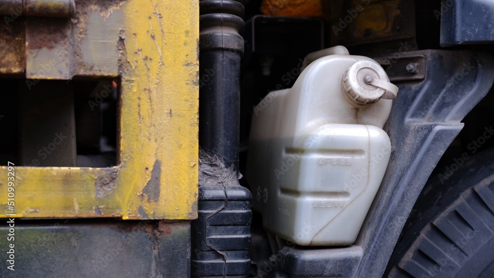 expansion tank with antifreeze liquid. Vehicle coolant level in the ...