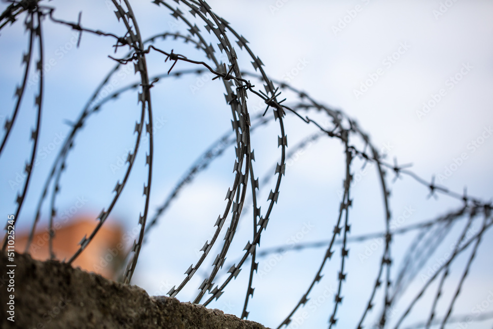 Barbed wire on the fence. Stock Photo | Adobe Stock