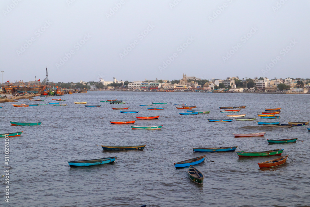 Fishing boats on the shallows and view of the village. Sightseeing in ...