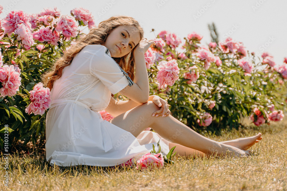 Beautiful Sexy Young Girl Sitting In A Flower Garden Young Woman In A Field Of Peonies The