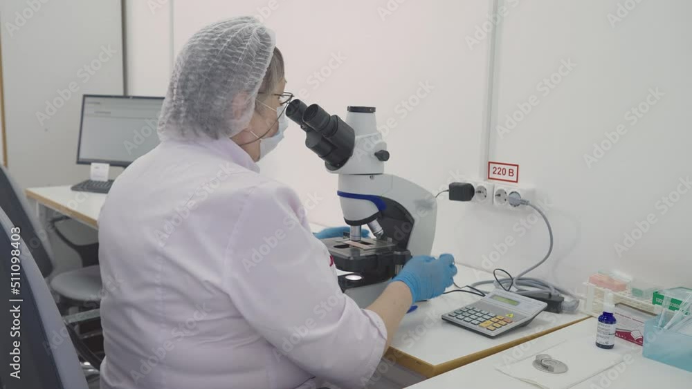 Medical Worker Conducts Microscopic Blood Test To Diagnose Disease In ...