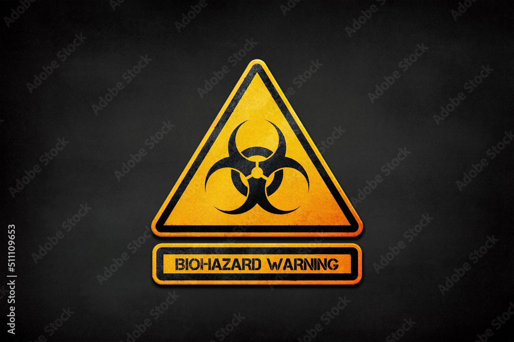 Yellow triangle warning sign with biohazard symbol on black background ...