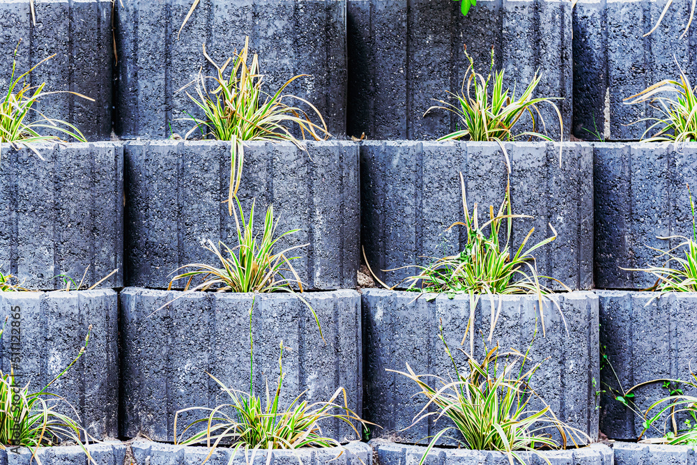 pyramid of concrete flower beds with plants. modern urban design. Stock ...