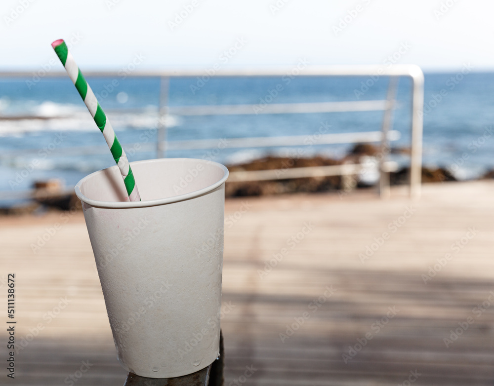 Glass of refreshing drink with beachfront drops Stock Photo | Adobe Stock