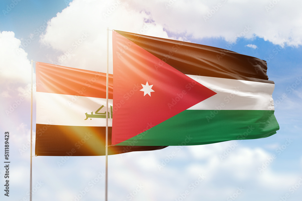 Sunny blue sky and flags of jordan and iraq Stock Photo | Adobe Stock