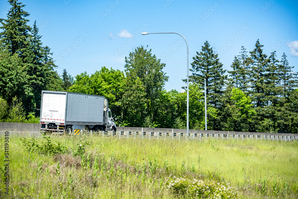 Day cab big rig semi truck with long box trailer and roof spoiler ...