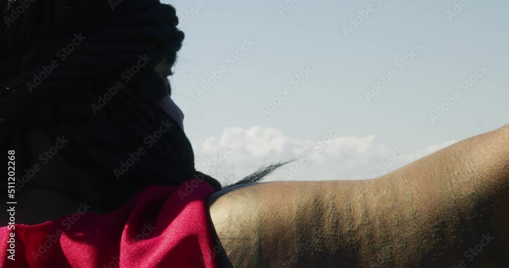 Samson raising tattoed arm with back to screen, Biblical character with ...