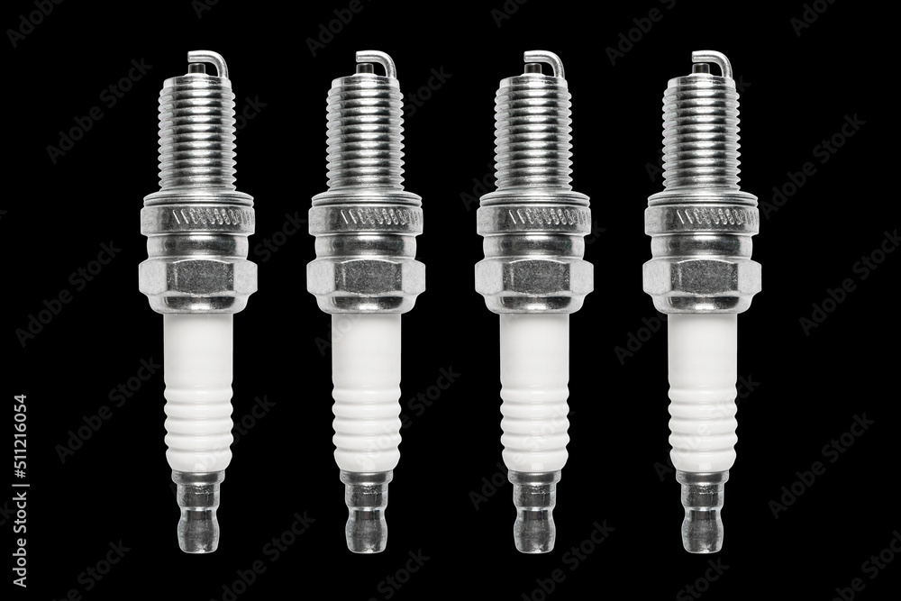 Macro shot of spark plug isolated on black background. A spark plug for ...