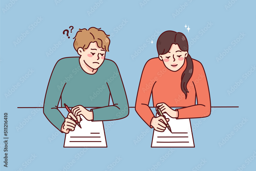 Boy cheating on school exam copy answers from female classmate ...