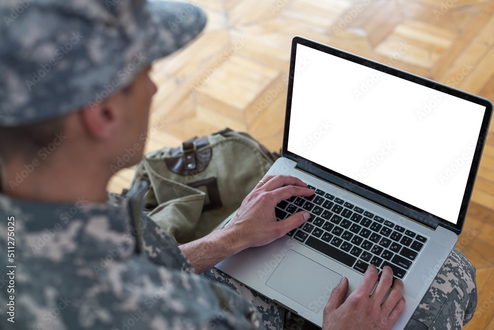 soldier in military uniform using high tech computer in headquarters ...