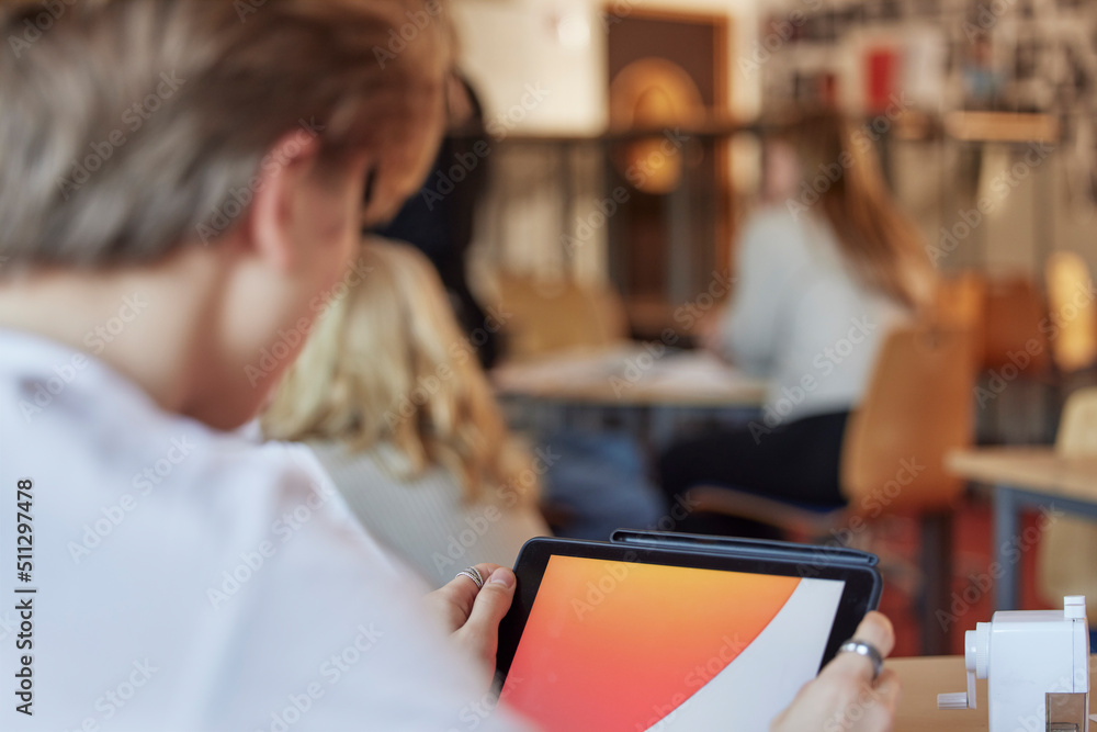 Student using tablet in class Stock Photo | Adobe Stock