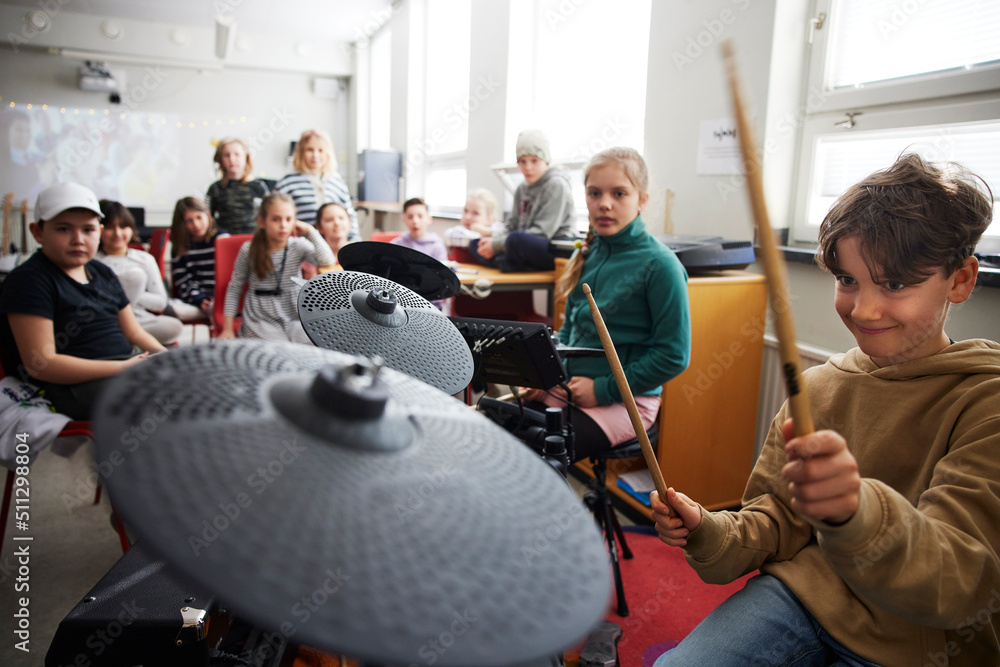 Children playing drums at school Stock Photo | Adobe Stock