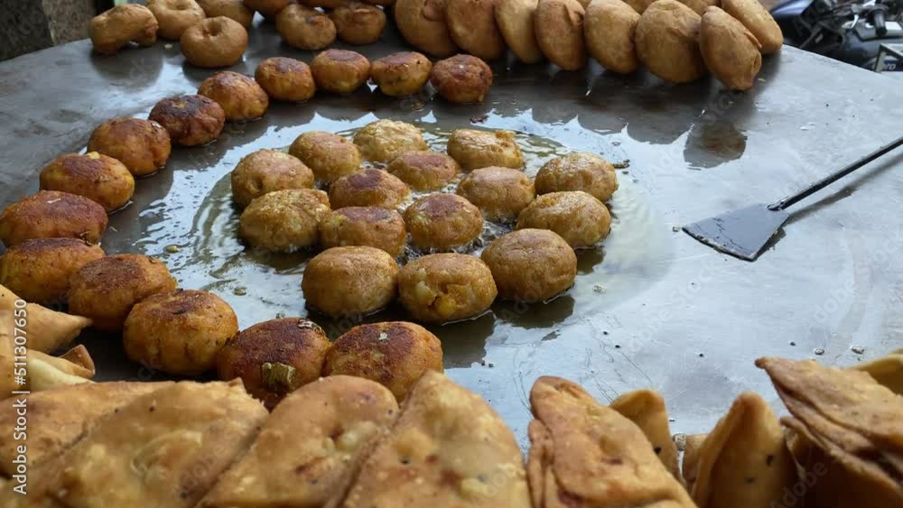 Alu ki Tikki or Indian snack Potato (Aloo) Patties fried in open street ...